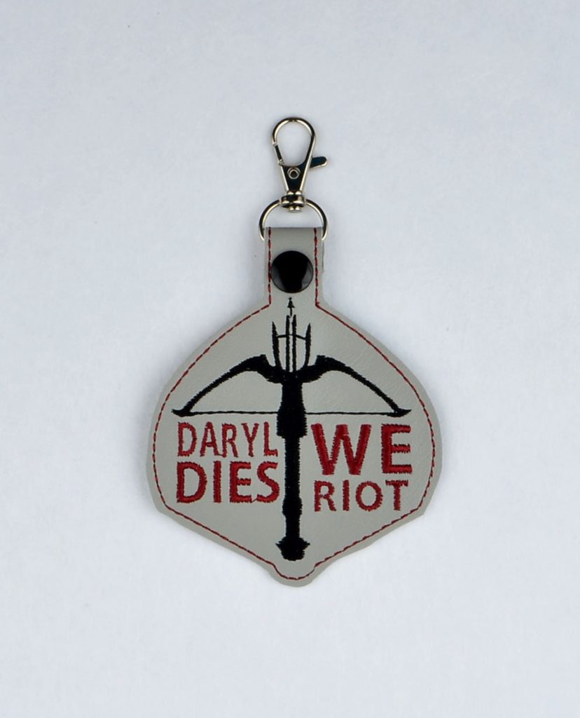 Daryl Dies We Riot Snap Tab Key Fob – String Theory Fabric Art